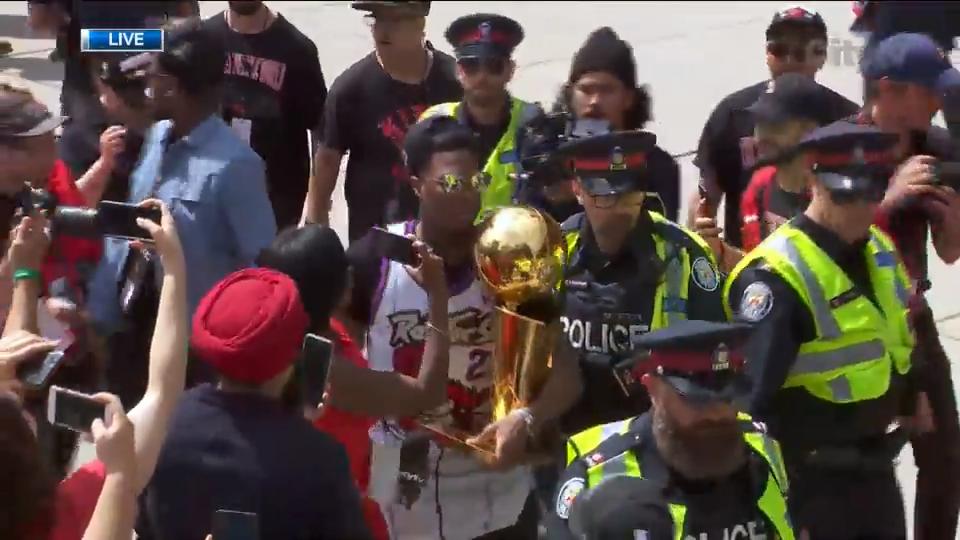 Kyle Lowry carries Larry O'Brien Championship Trophy on stage