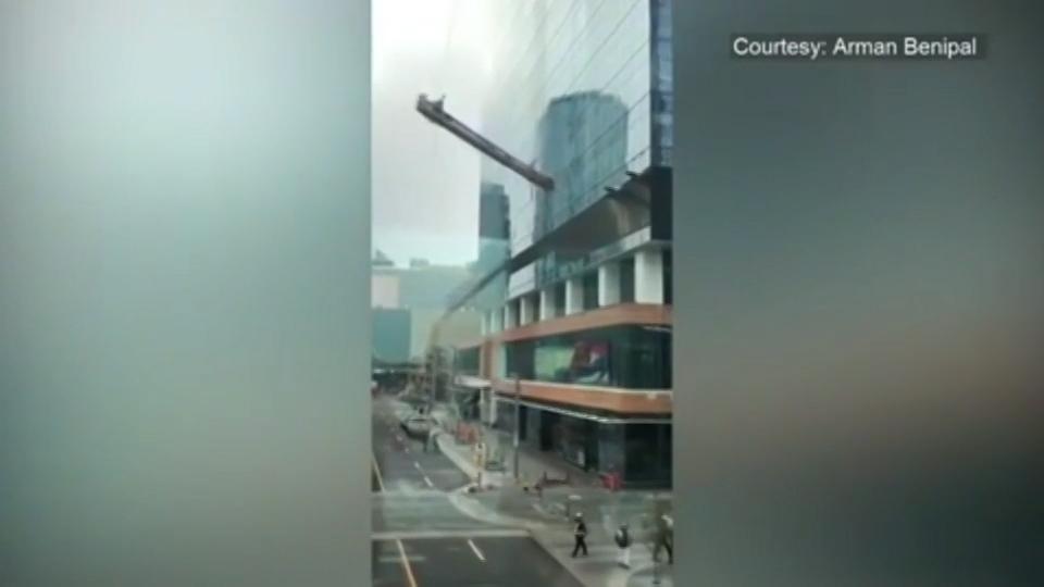 Terrifying moment worker falls from window washing rig caught on video